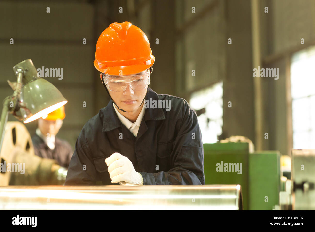 Male workers, chinese factory hi-res stock photography and images - Alamy