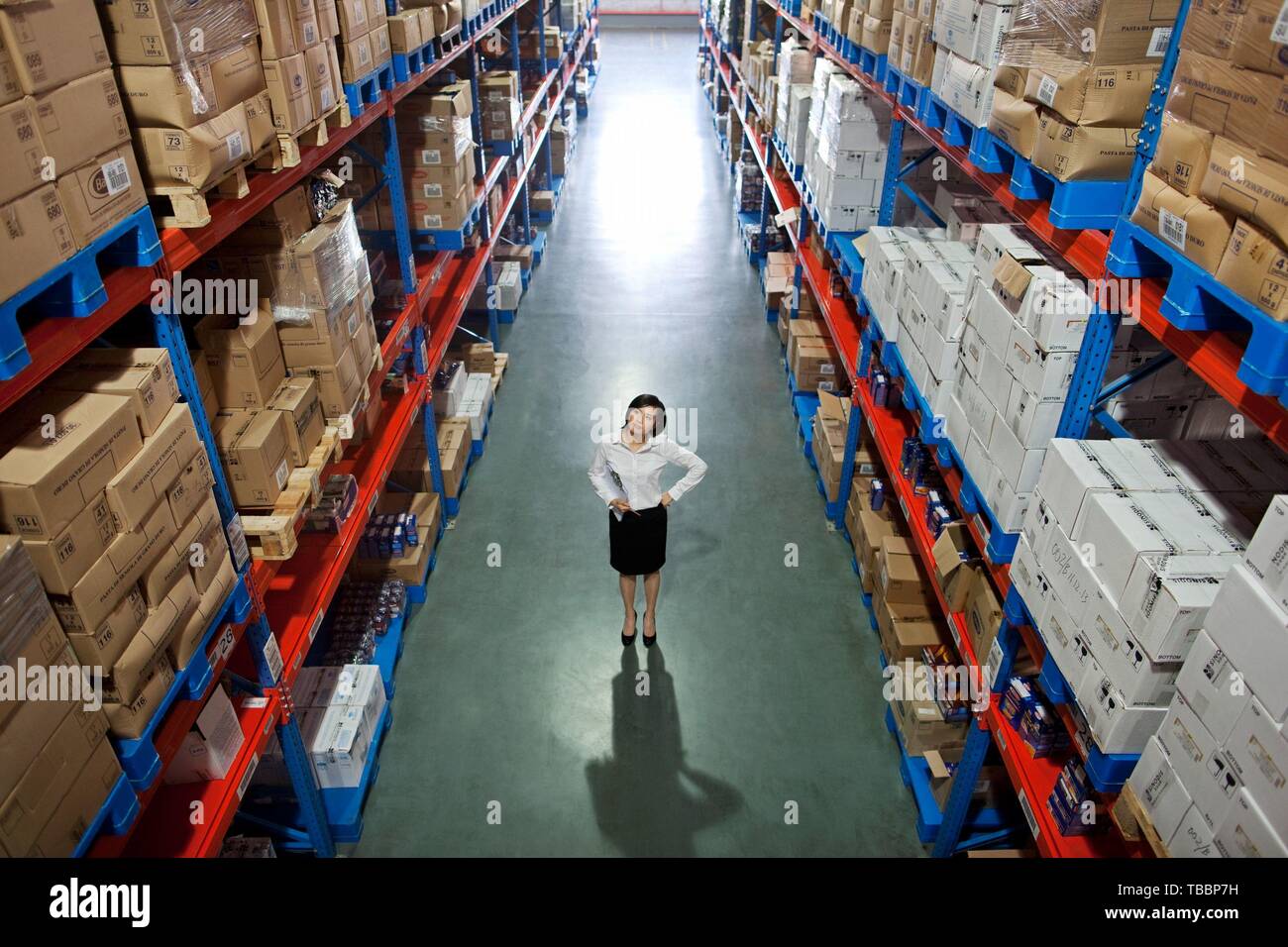 Old woman stacking shelves hi-res stock photography and images - Alamy