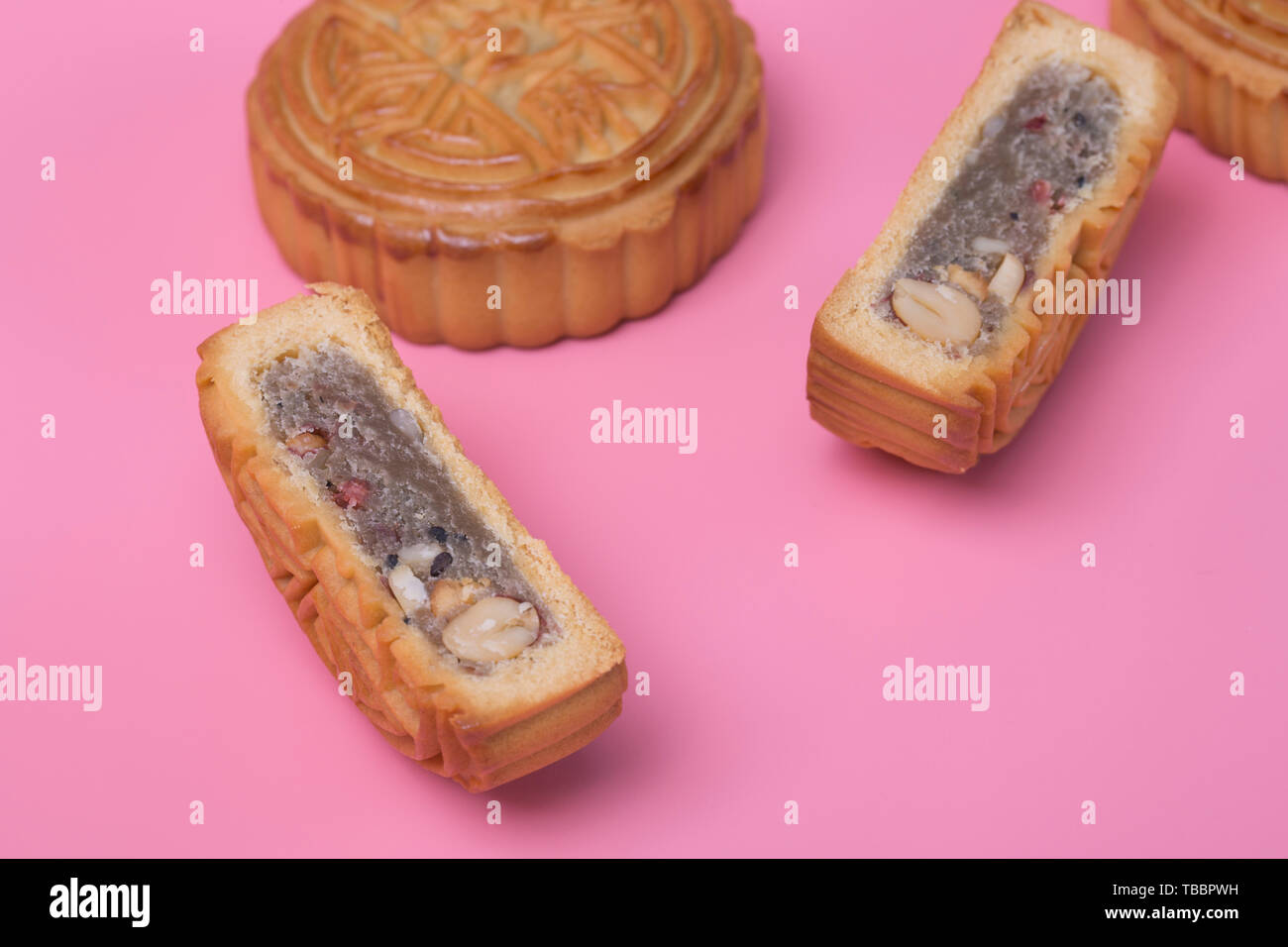 Moon cakes on pink background Stock Photo - Alamy