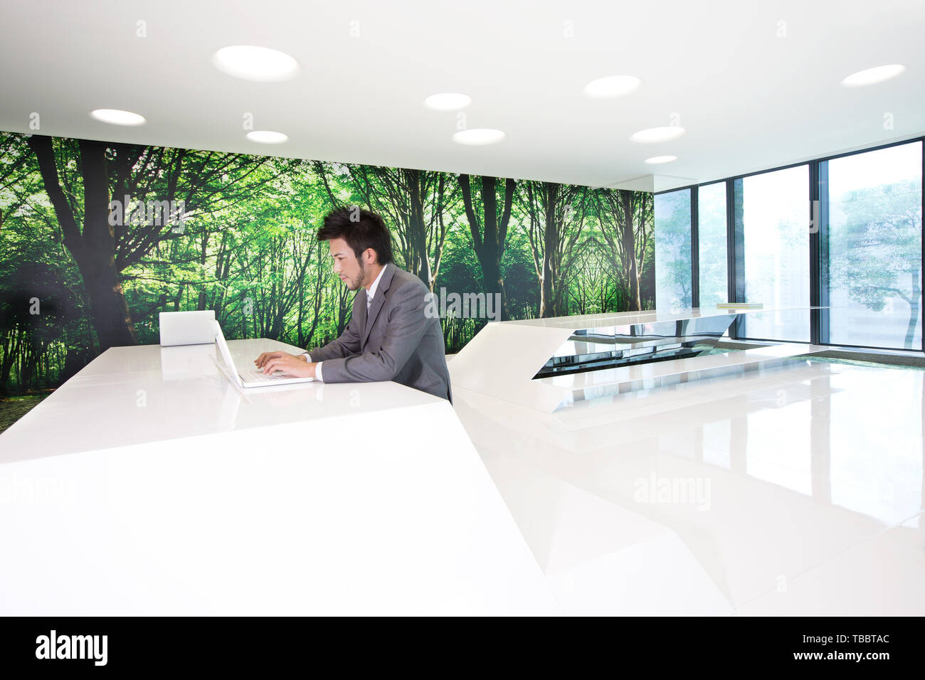 Male white collar worker working in office Stock Photo - Alamy
