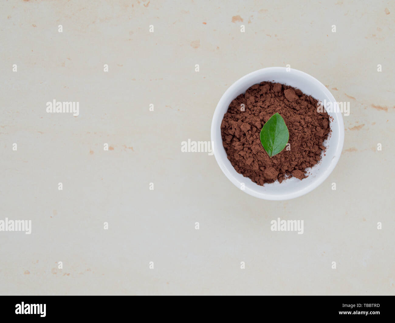 Bowl of powder cocoa. Top view, stone background Stock Photo - Alamy