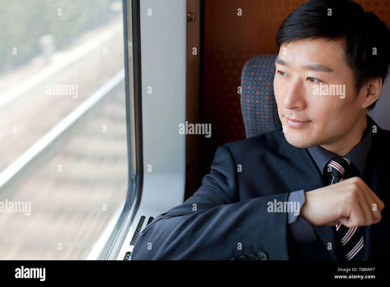 A business person on a train Stock Photo - Alamy