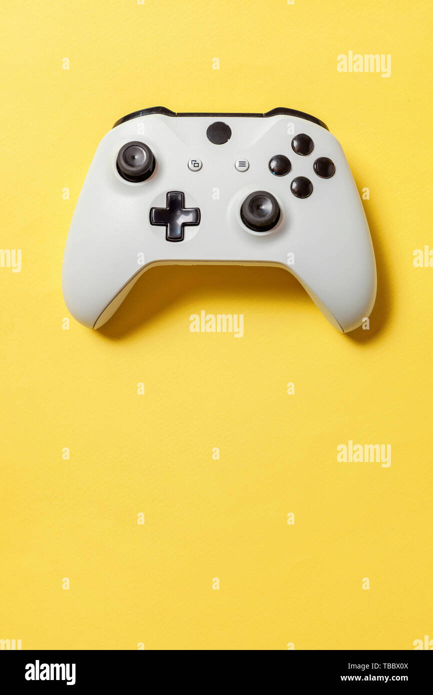 White joystick gamepad, game console on yellow colourful trendy modern ...