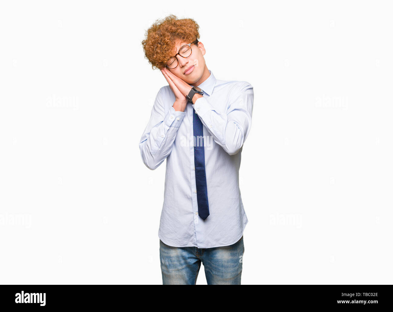 Young handsome business man with afro wearing glasses sleeping tired ...