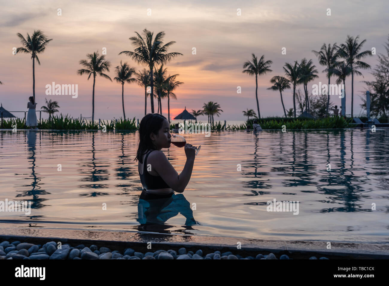 Woman drinking wine and pool hi-res stock photography and images - Alamy