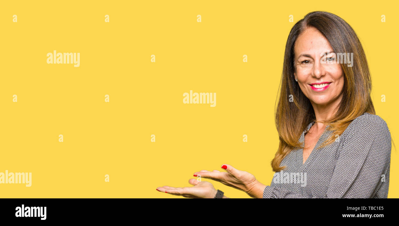 Beautiful middle age business woman Inviting to enter smiling natural ...