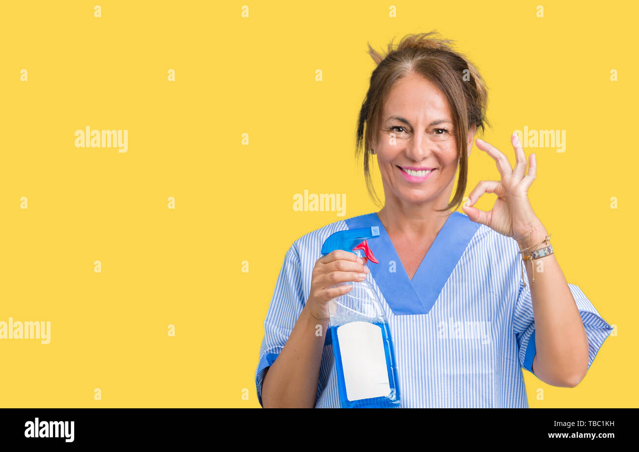 Middle age brunette cleaner woman wearing housework uniform over ...