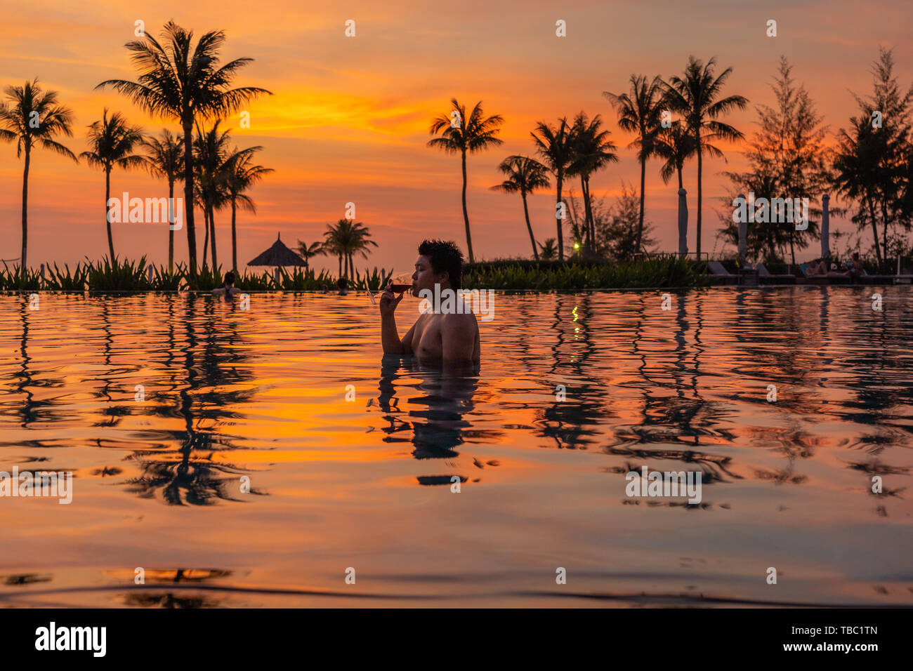 Drinking champagne in pool hi-res stock photography and images - Alamy