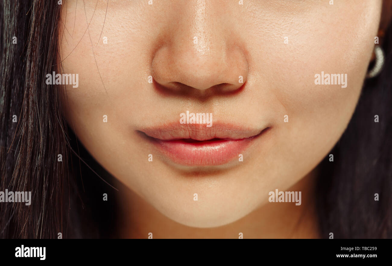 Korean young woman's close up portrait. Female model's smiling lips ...