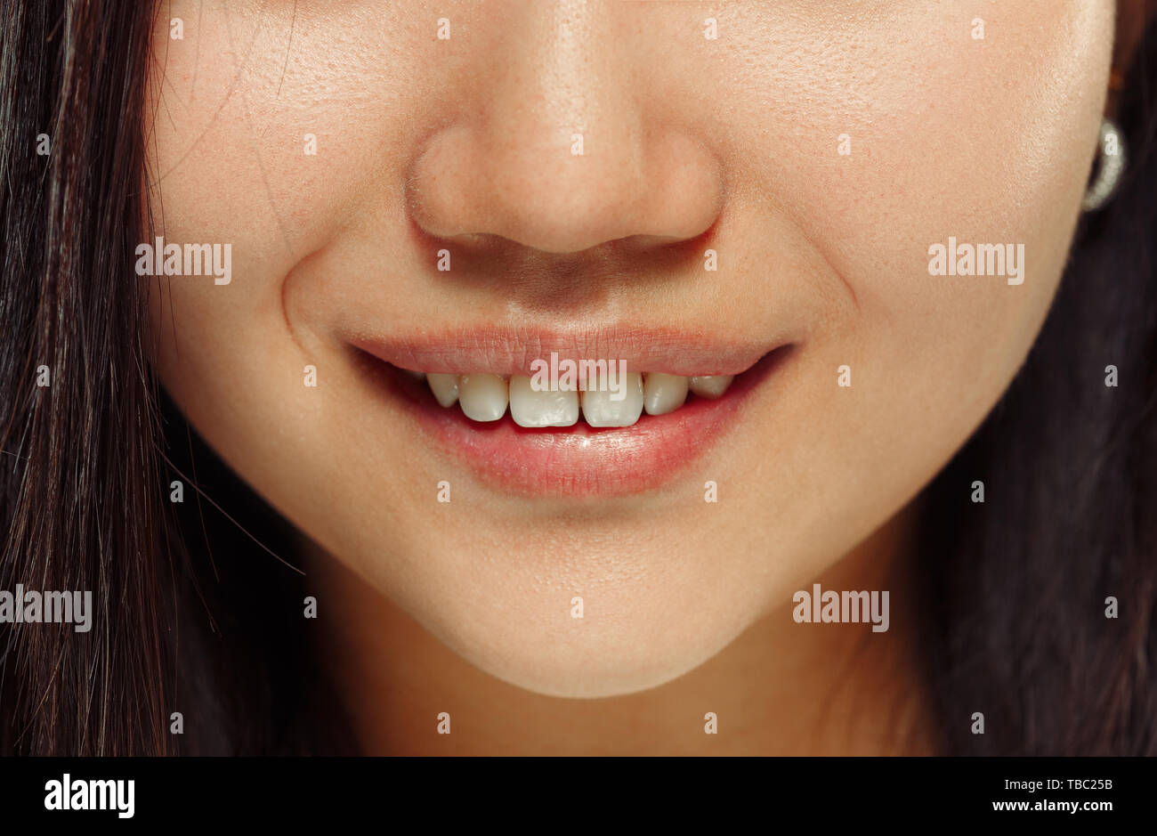 Korean young woman's close up portrait. Female model's smiling lips ...
