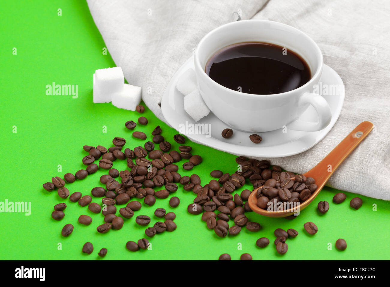 Cup of coffee on green background Stock Photo - Alamy