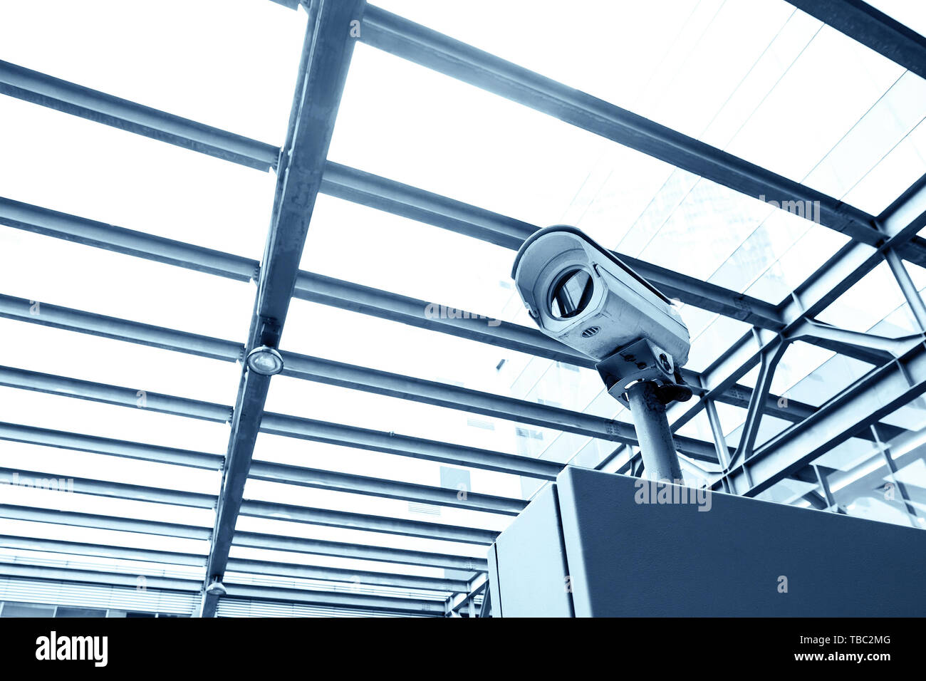 Overhead security camera in a modern office building Stock Photo - Alamy