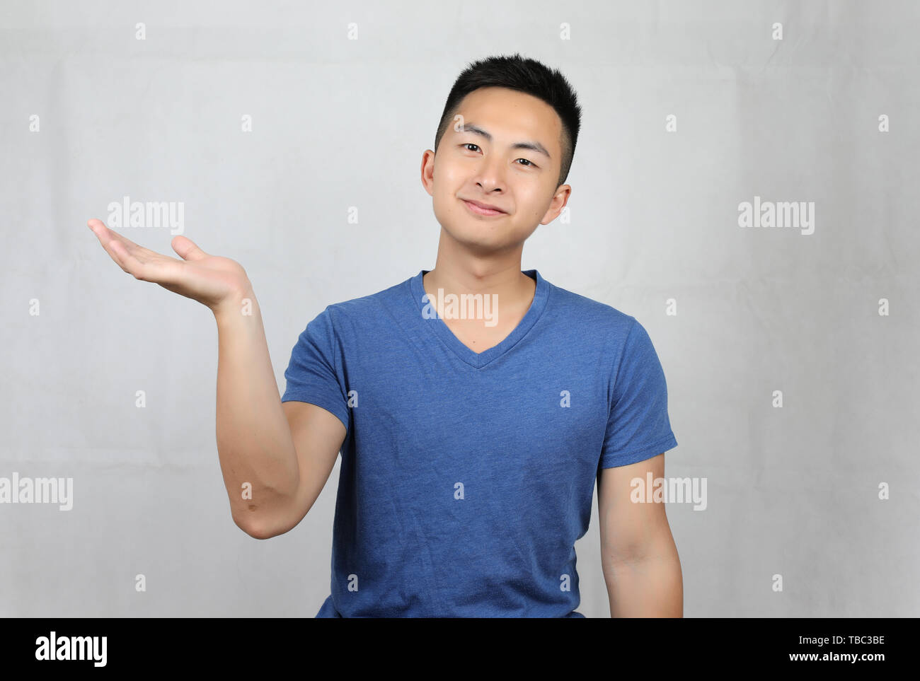 Portrait of male portrait on white background introduction gesture ...
