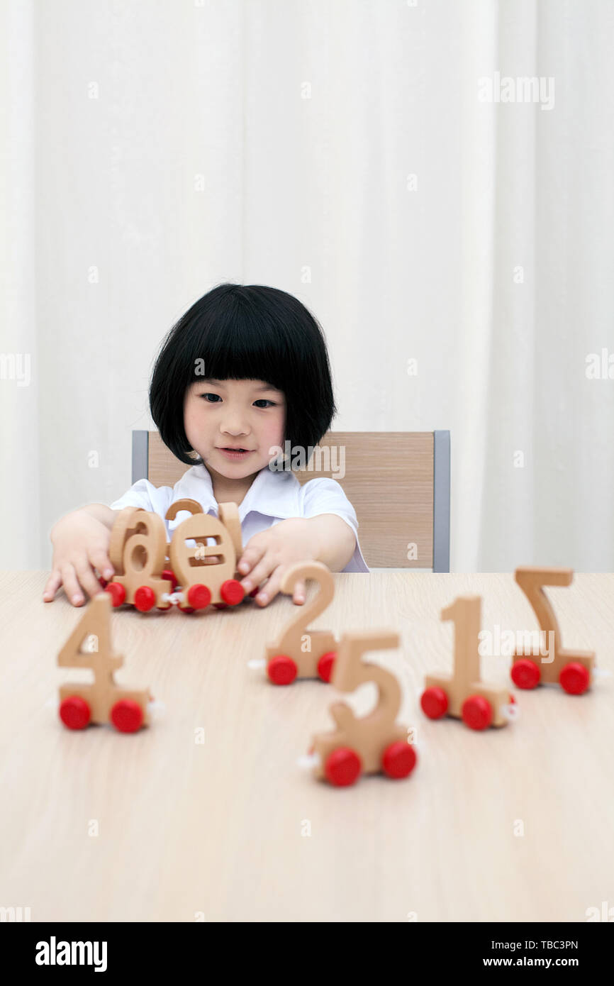 A child acquires knowledge in a game Stock Photo - Alamy
