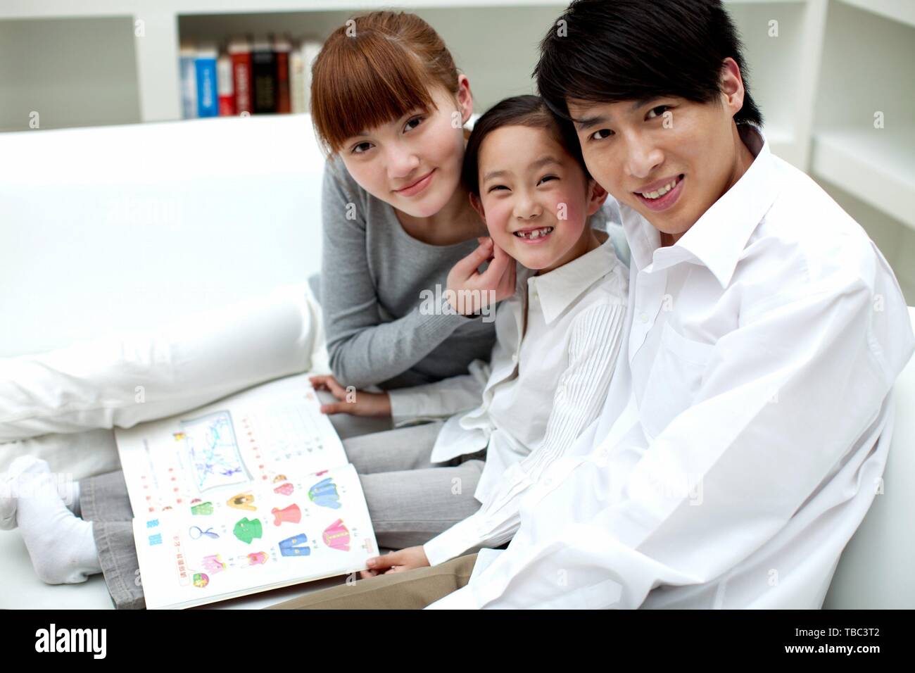 A family of three Stock Photo - Alamy
