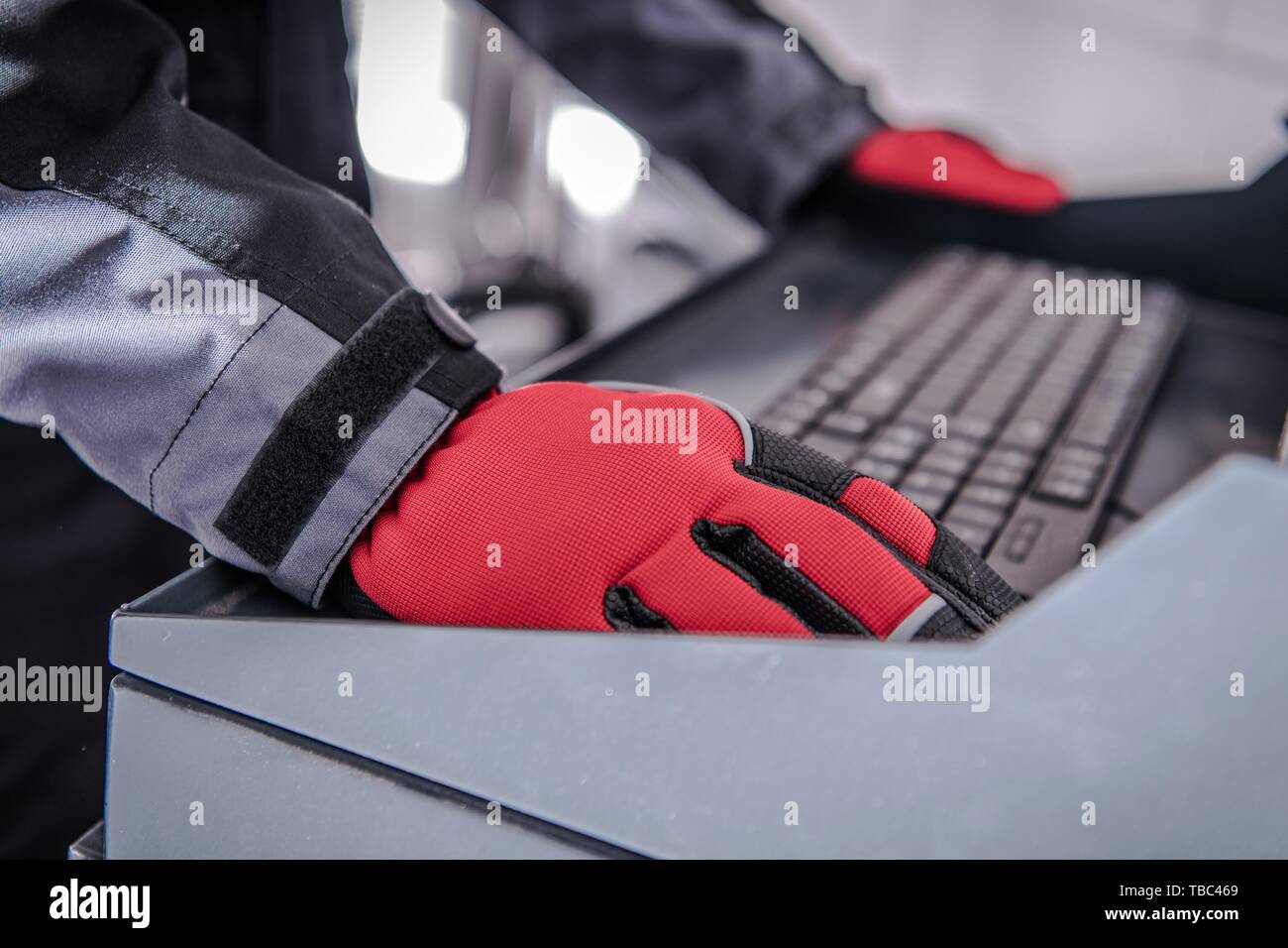 Car Diagnostic Computer. Auto Service Worker Hands on Computer Keyboard ...