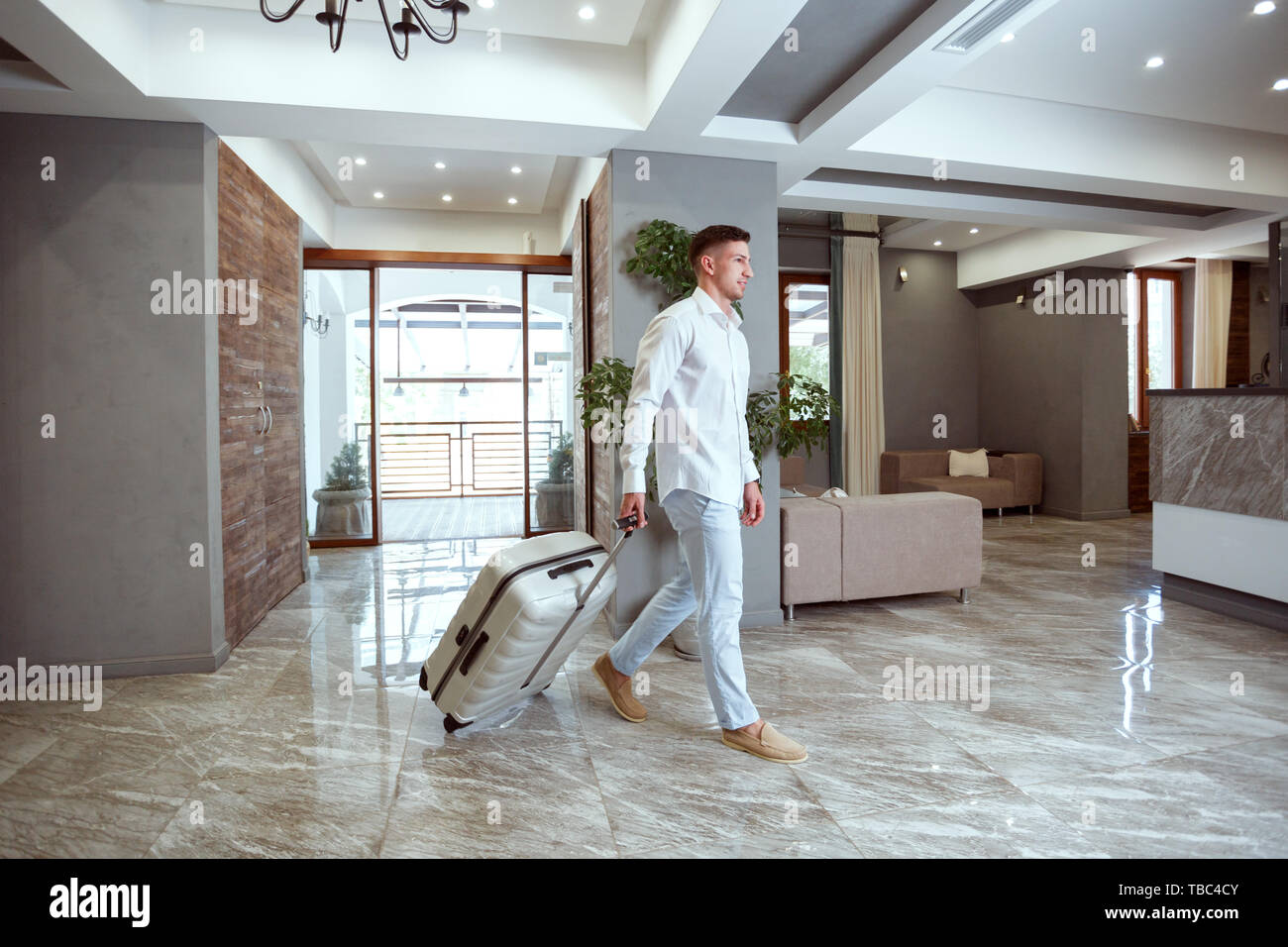 man at hotel reception Stock Photo - Alamy