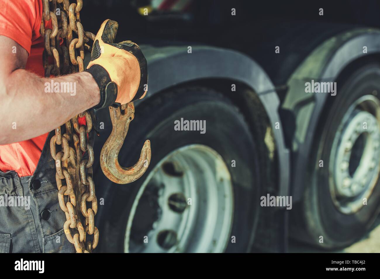 Trucker with Heavy Chains and Hook For Securing Cargo Load ...