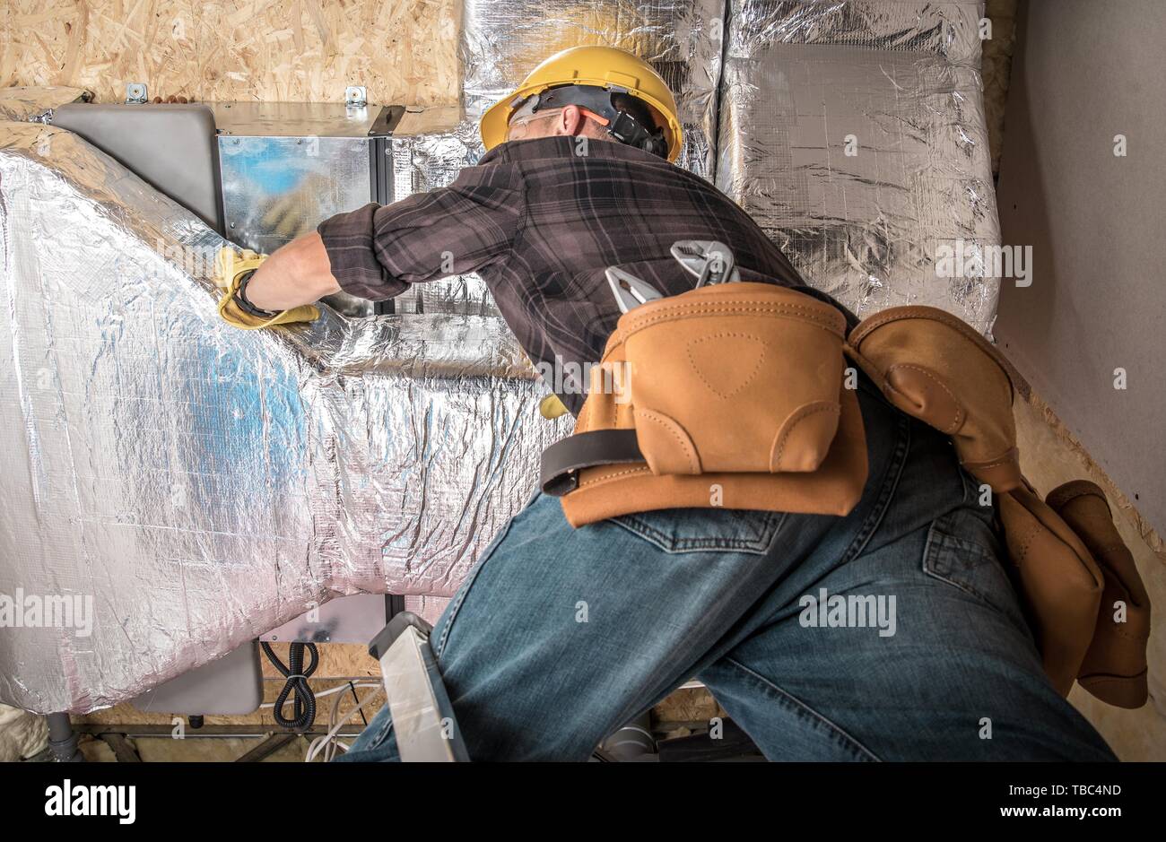Worker installing ventilation ductwork hi-res stock photography and ...