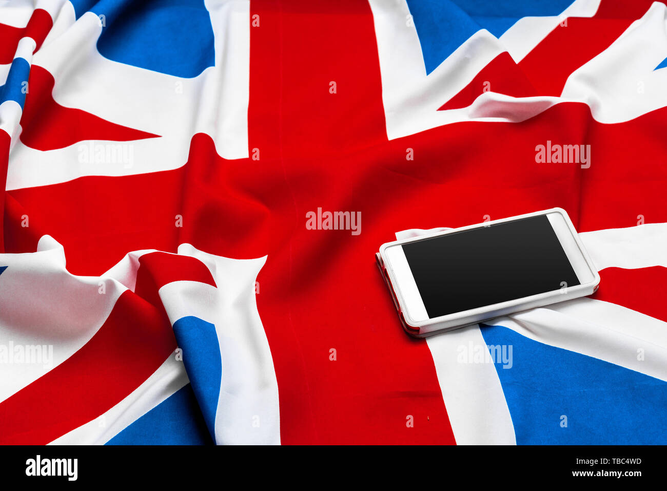 smart phone or cell phone over United kingdom flag Stock Photo - Alamy