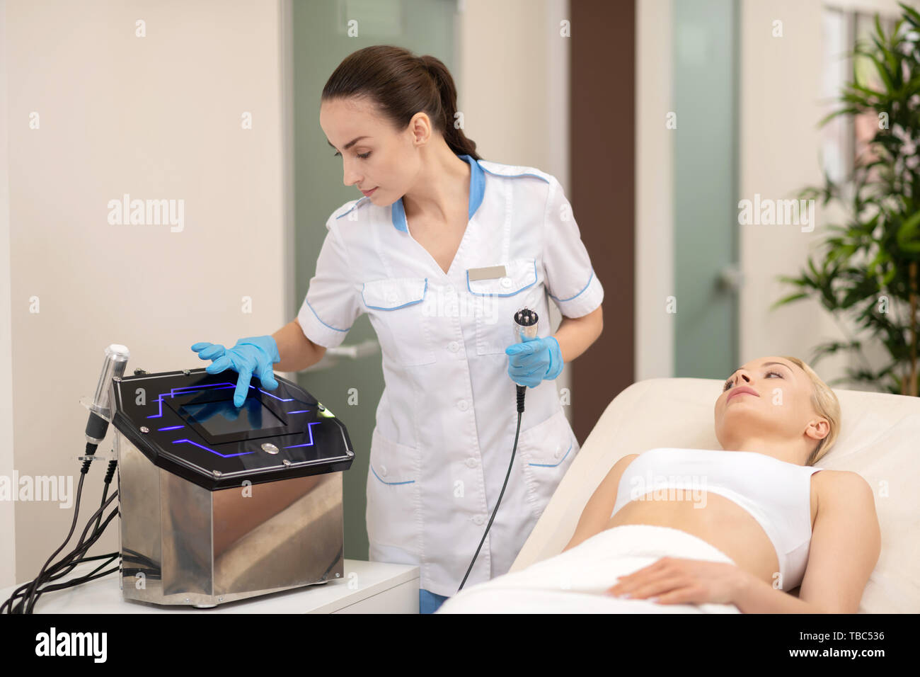 Anti-aging procedures. Dermatologist doing anti-aging procedures for ...