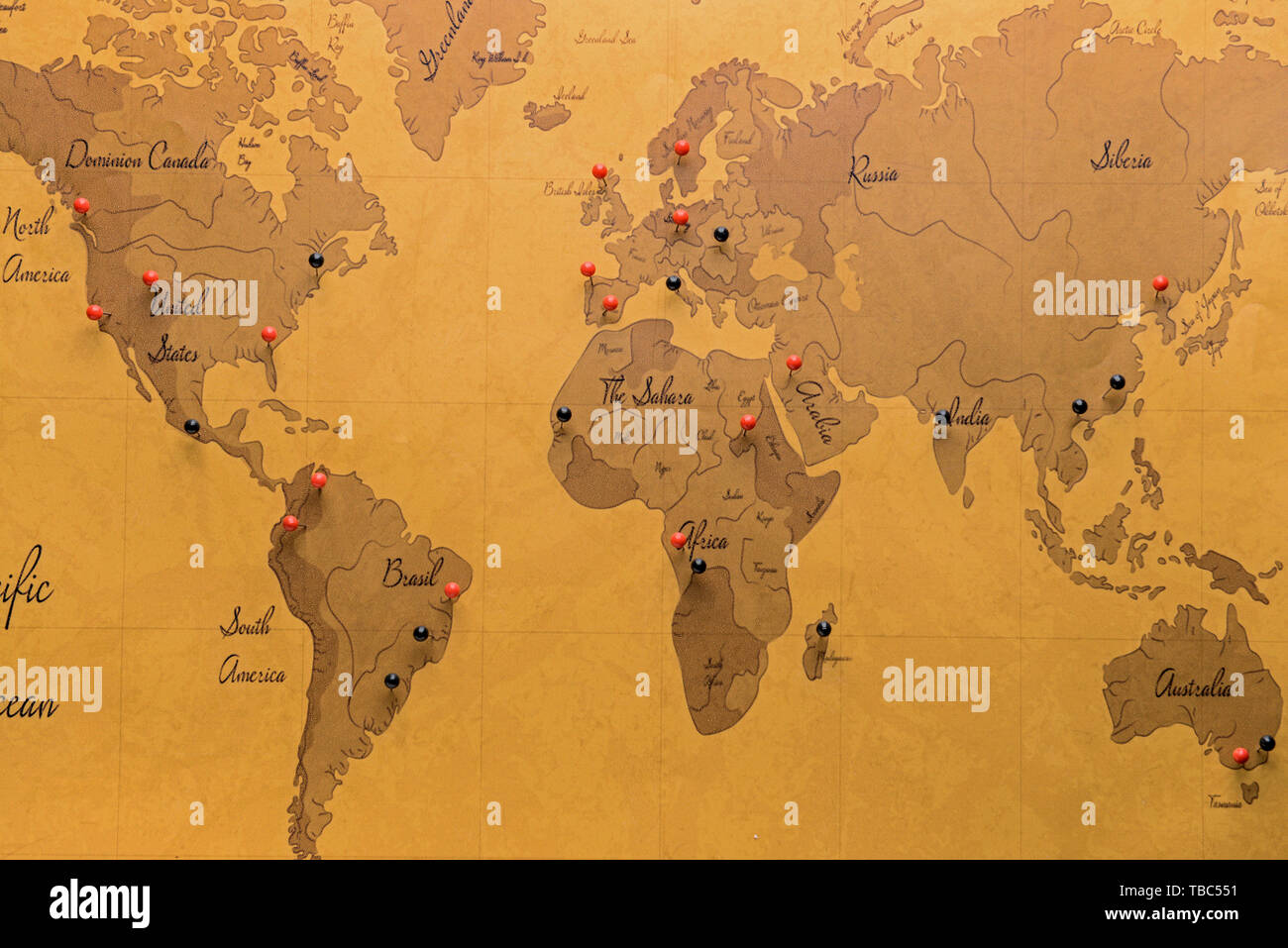 Pins on world map, top view Stock Photo - Alamy