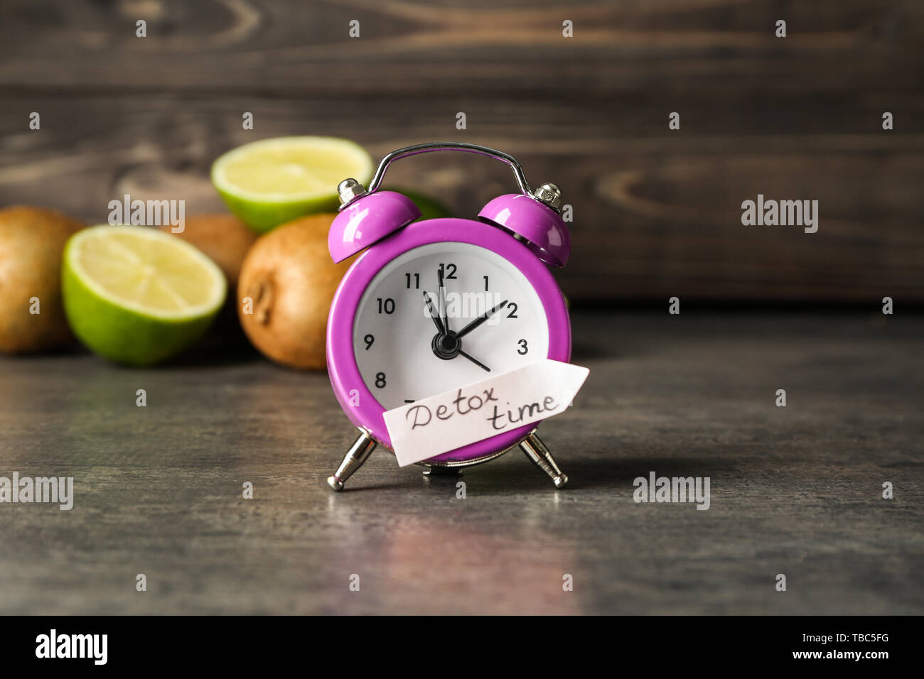 Alarm clock with text DETOX TIME on grey table Stock Photo - Alamy