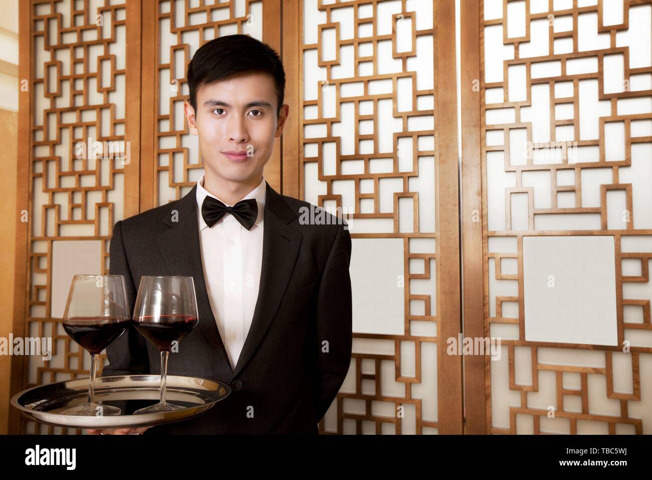 Chinese waiter hotel hi-res stock photography and images - Alamy
