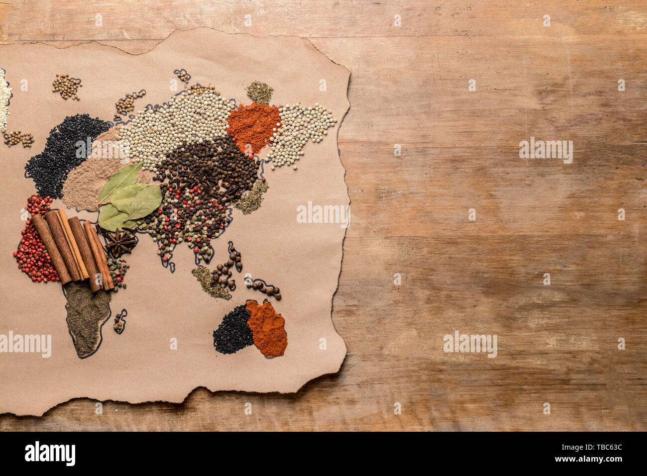 World map made of different spices on wooden background Stock Photo - Alamy