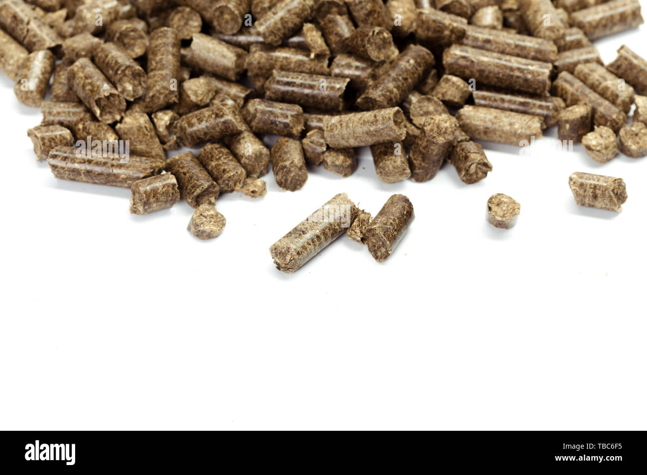 stack of wooden pellets for bio energy, white background, isolated ...