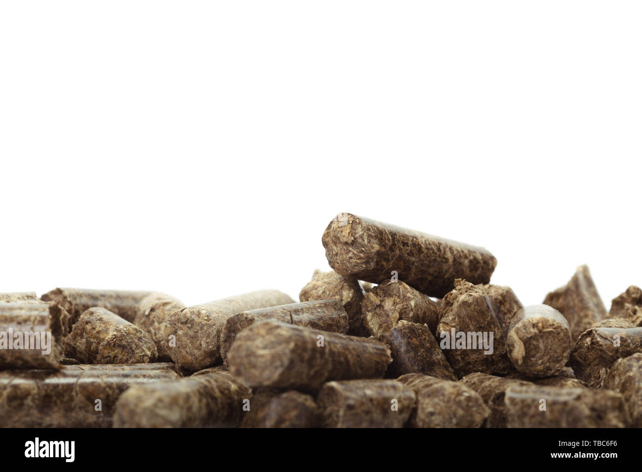 stack of wooden pellets for bio energy, white background, isolated ...