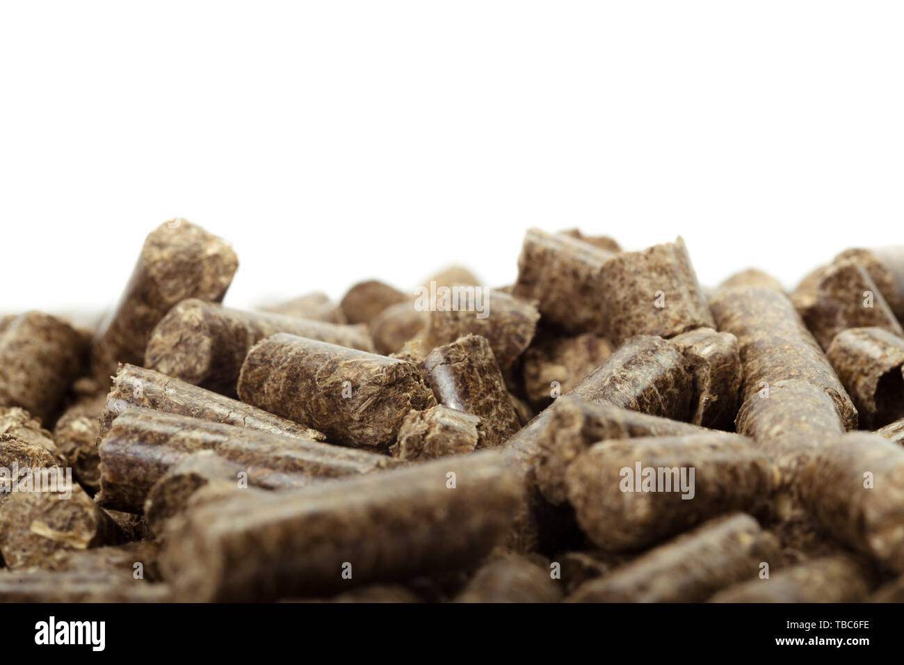 stack of wooden pellets for bio energy, white background, isolated ...