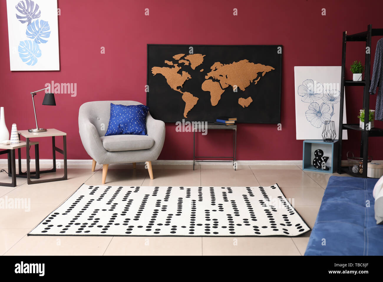 Interior of living room with picture of map on wall Stock Photo - Alamy