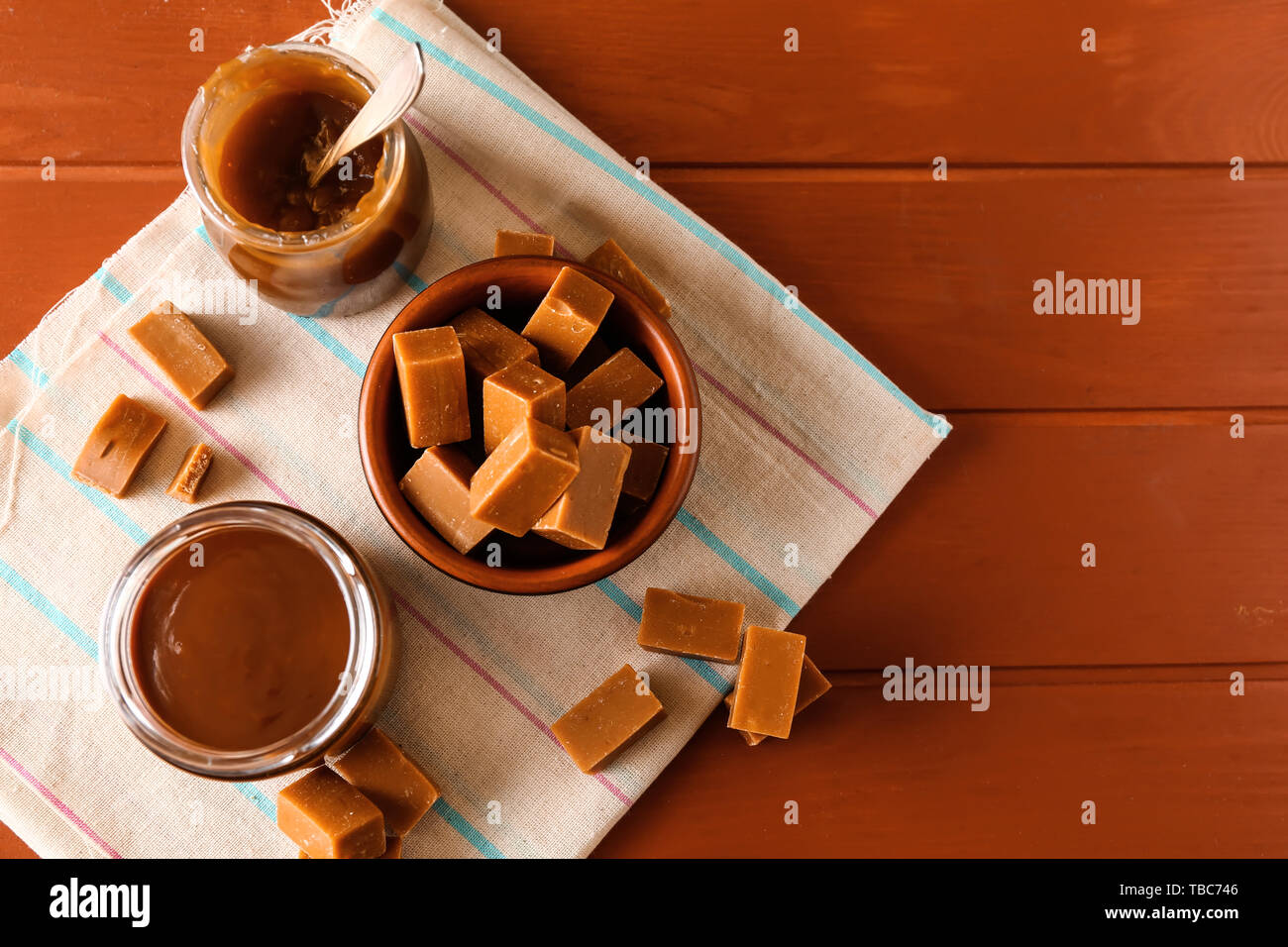 Composition with tasty caramel on table Stock Photo - Alamy