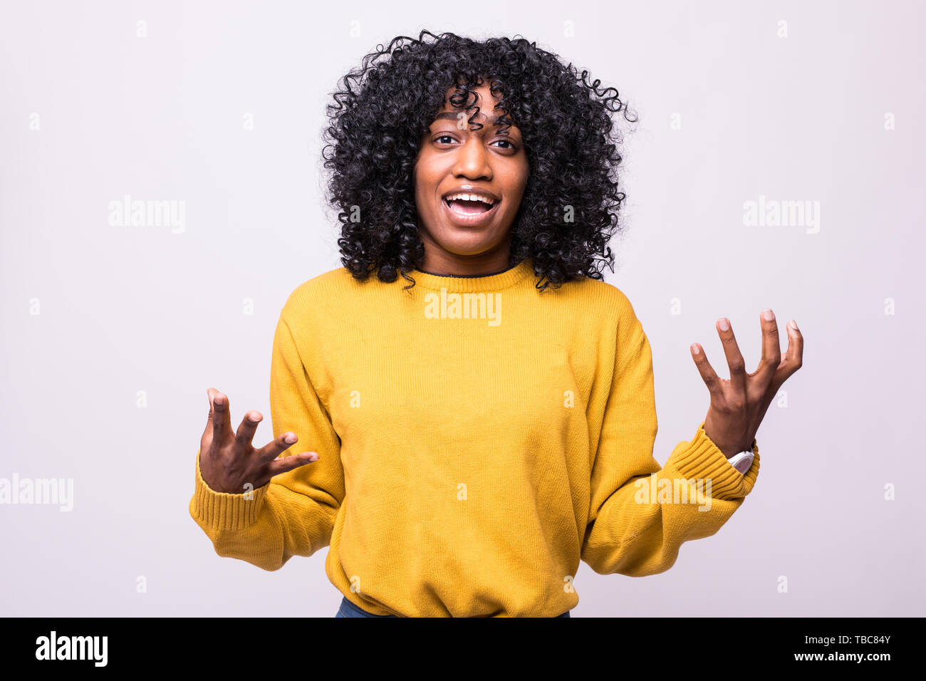 Enraged young woman with hands up yelling Stock Photo - Alamy