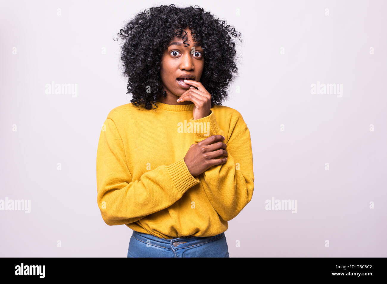 Headshot of beautiful scared young dark-skinned European female with ...