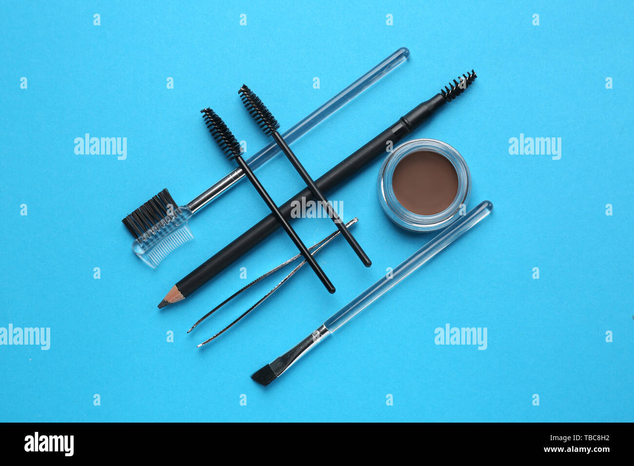 Set of tools for eyebrows correction on color background Stock Photo ...