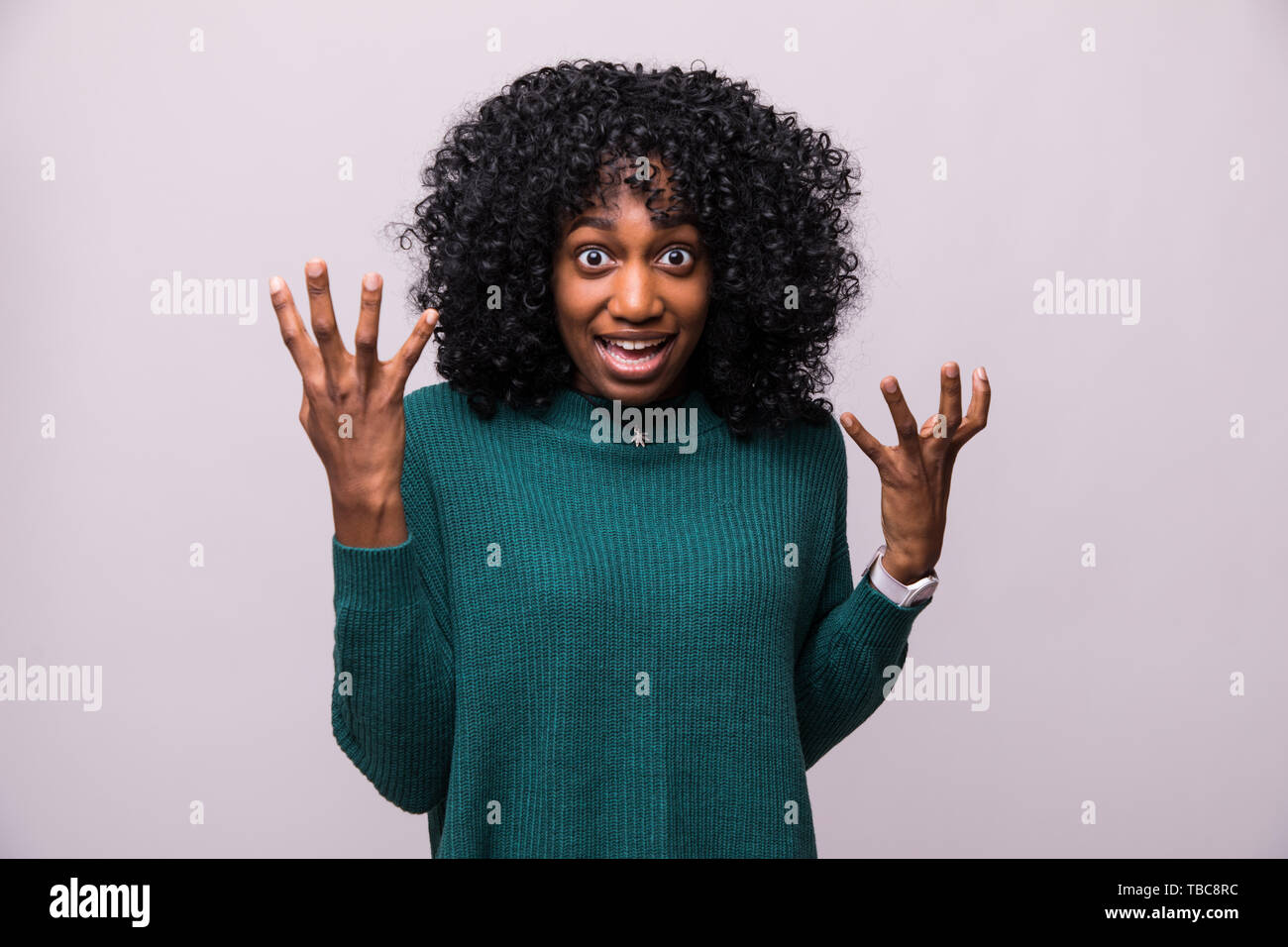 Enraged young woman with hands up yelling Stock Photo - Alamy