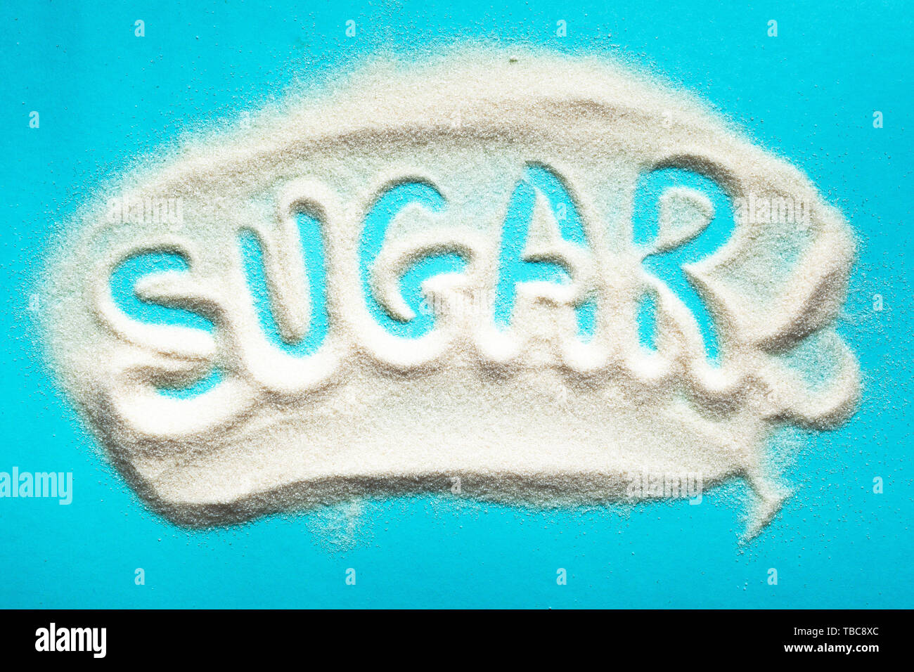 The word sugar written into a pile of white granulated sugar Stock ...