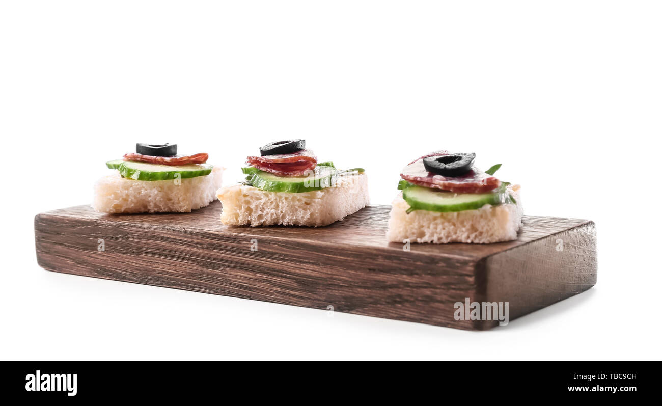 Board with tasty canapes on white background Stock Photo - Alamy