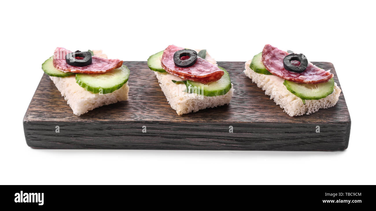 Board with tasty canapes on white background Stock Photo - Alamy