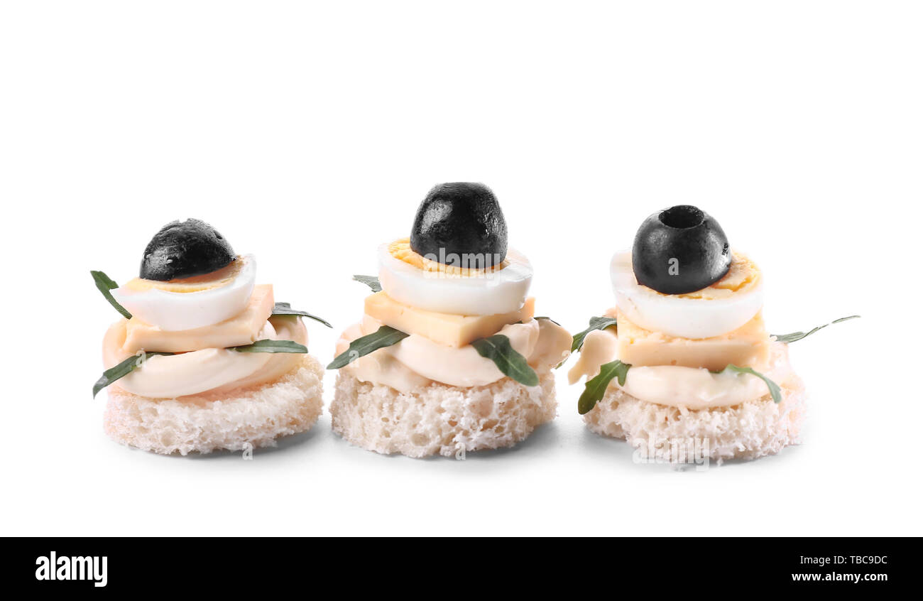 Tasty canapes on white background Stock Photo - Alamy