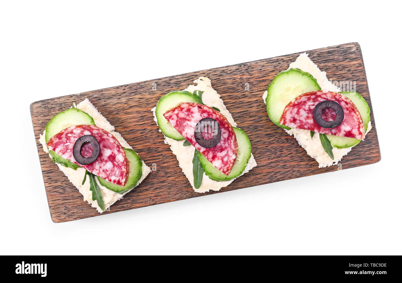 Board with tasty canapes on white background Stock Photo - Alamy