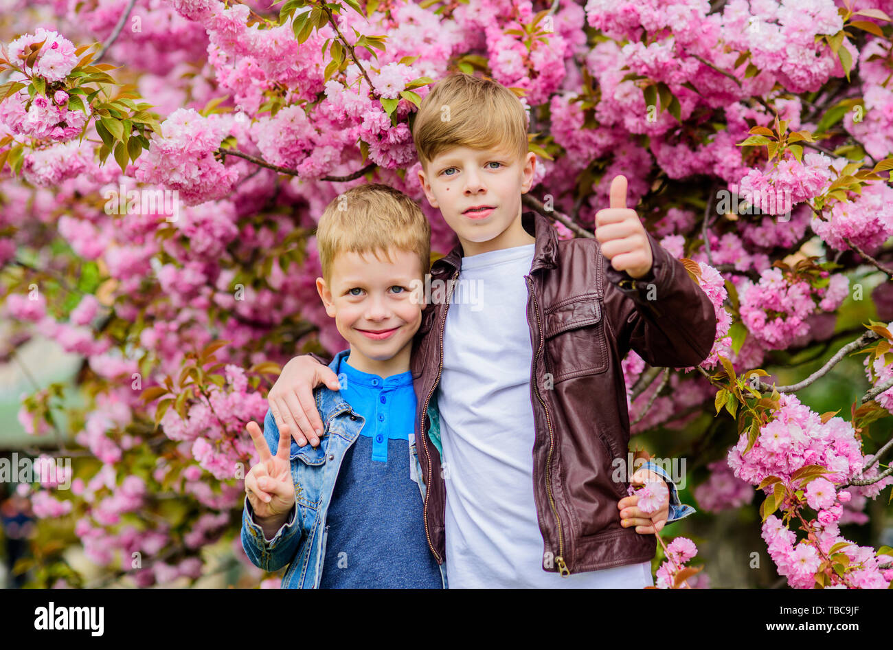 Happy spring holidays. Children enjoy warm spring. Boys posing near ...