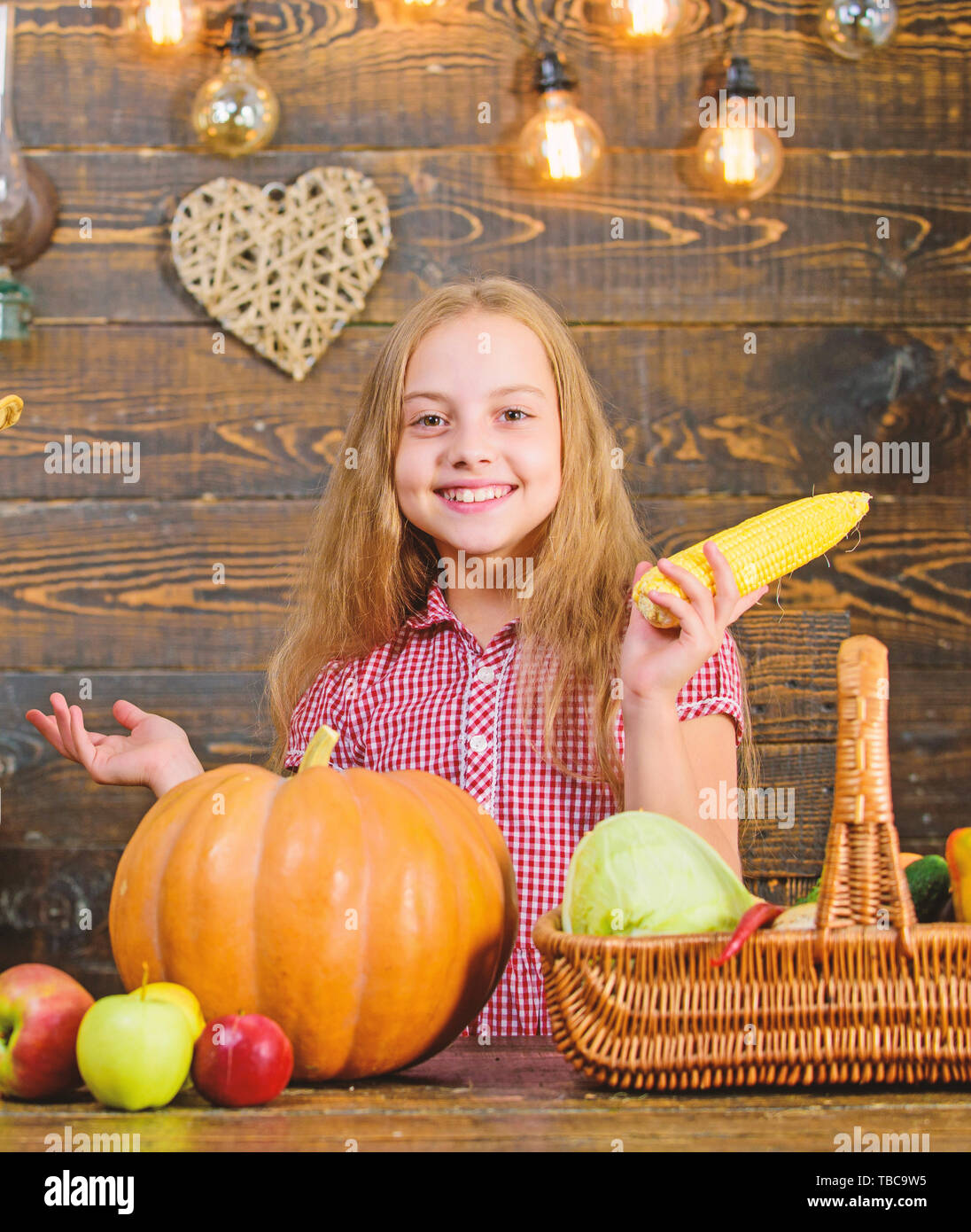 Harvest festival concept. Child little girl enjoy farm life. Organic ...