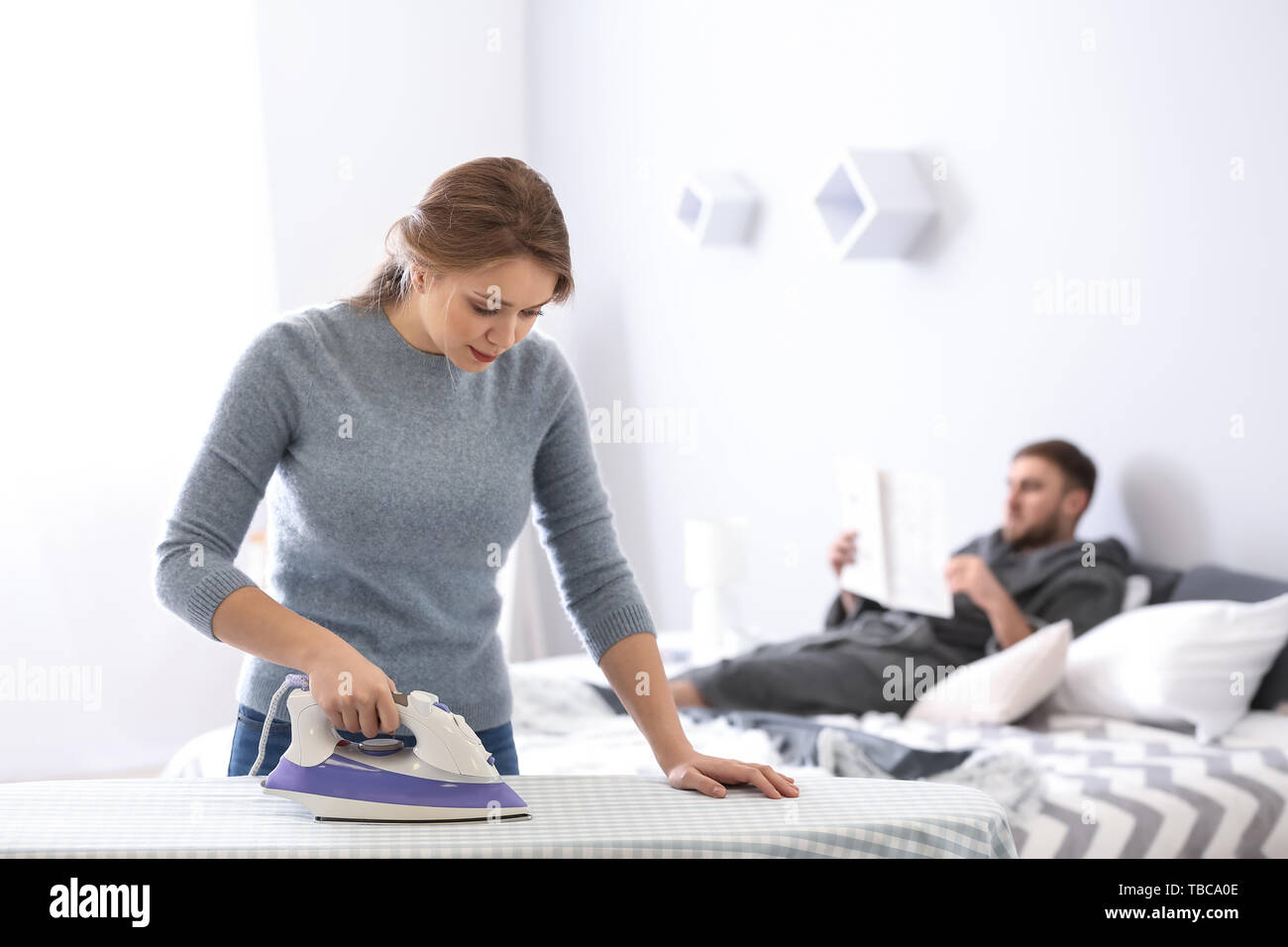 Housewife Ironing Clothes High Resolution Stock Photography and Images ...
