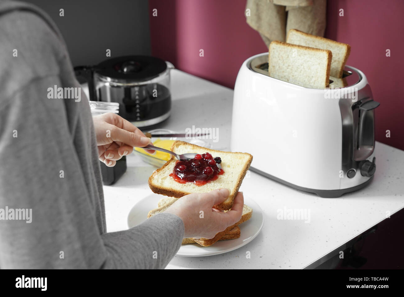 Woman eating jam bread hi-res stock photography and images - Alamy