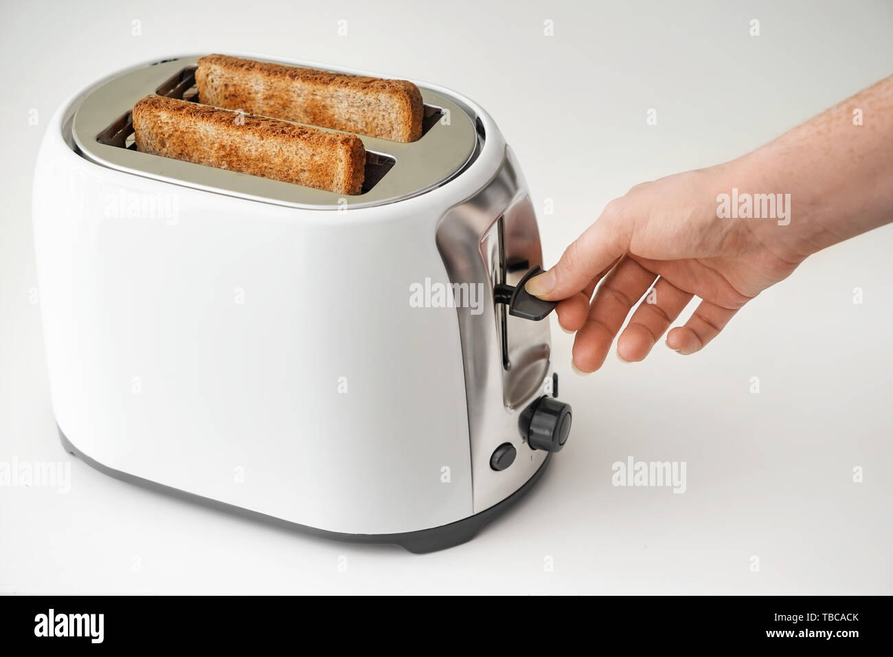 Woman making toasts for breakfast Stock Photo - Alamy