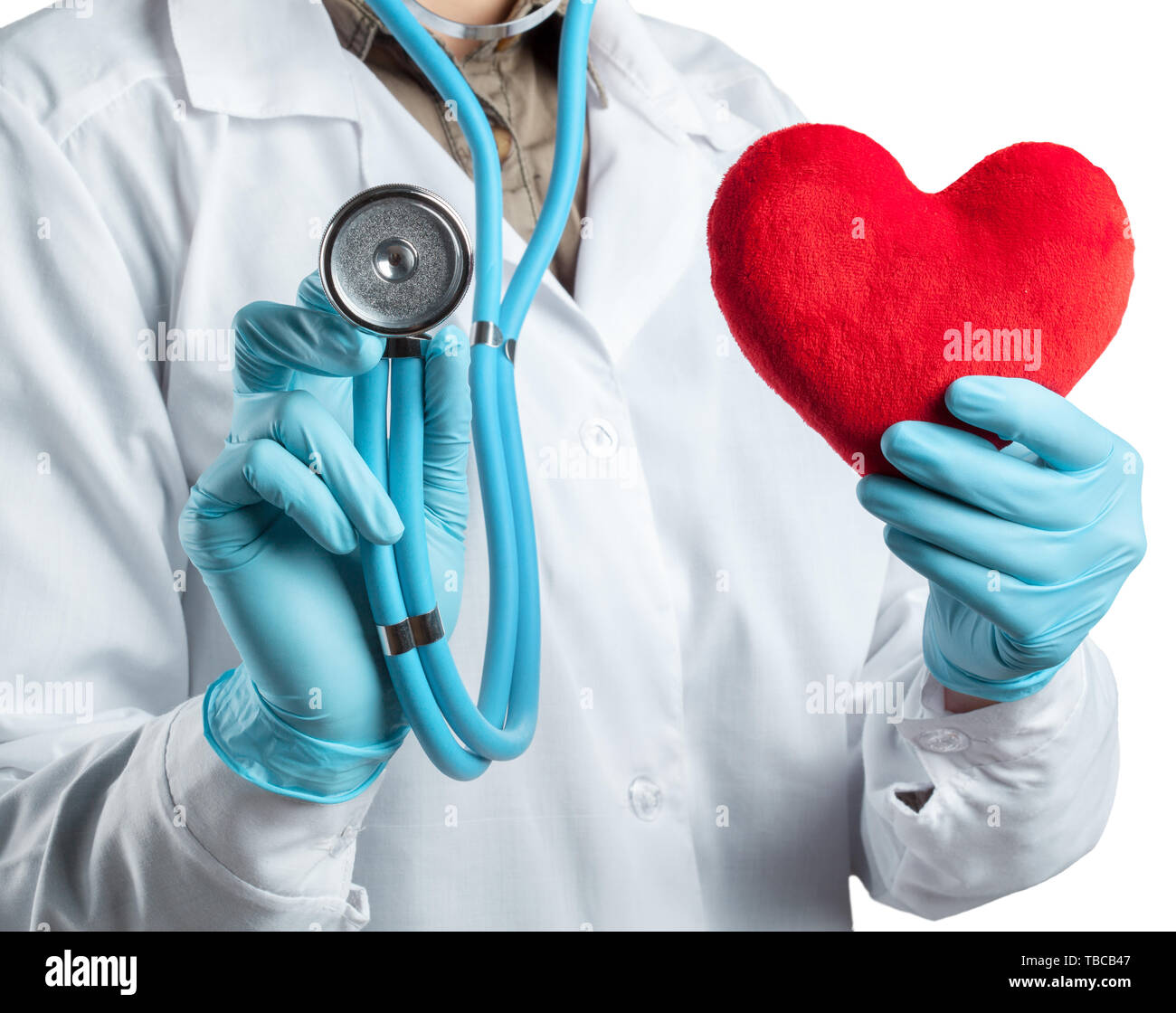 Female cardiologist in uniform holding red heart isolated on the white ...