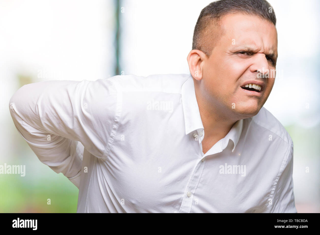 Middle age arab elegant man over isolated background Suffering of ...